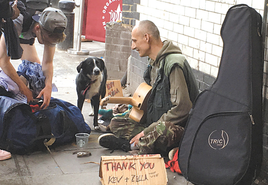 Day in the life of student George and homeless busker Kevin ...
